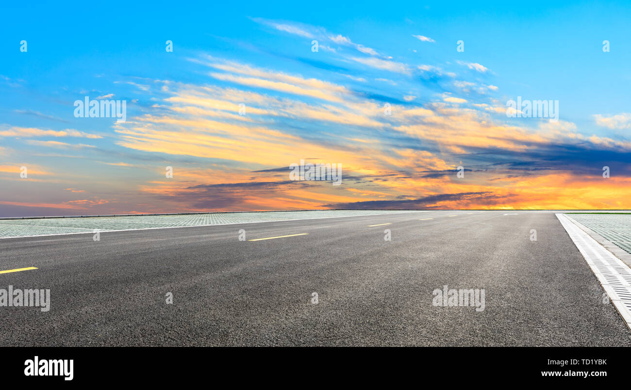 Asphalt road and sunset sky,panoramic view Stock Photo - Alamy