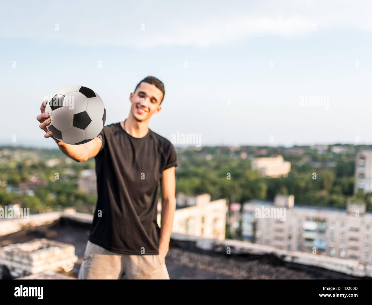 Man playing football urban hi-res stock photography and images - Alamy