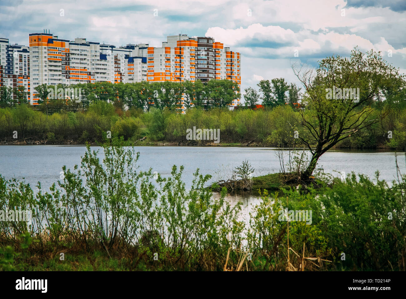 View of high-rise buildings from the river Bank Stock Photo - Alamy