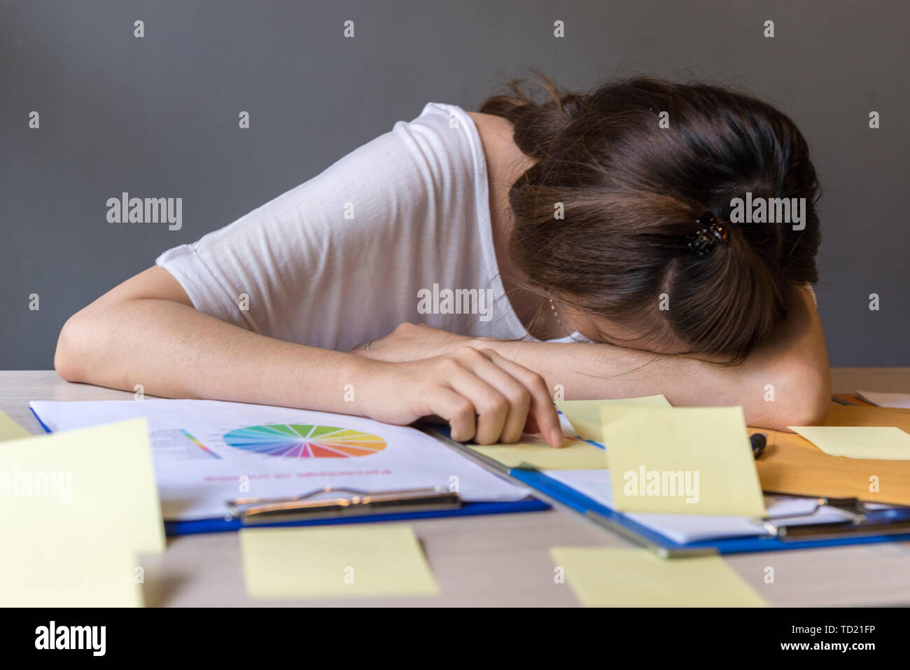 Close up photo of tired woman fall asleep on desk Stock Photo - Alamy