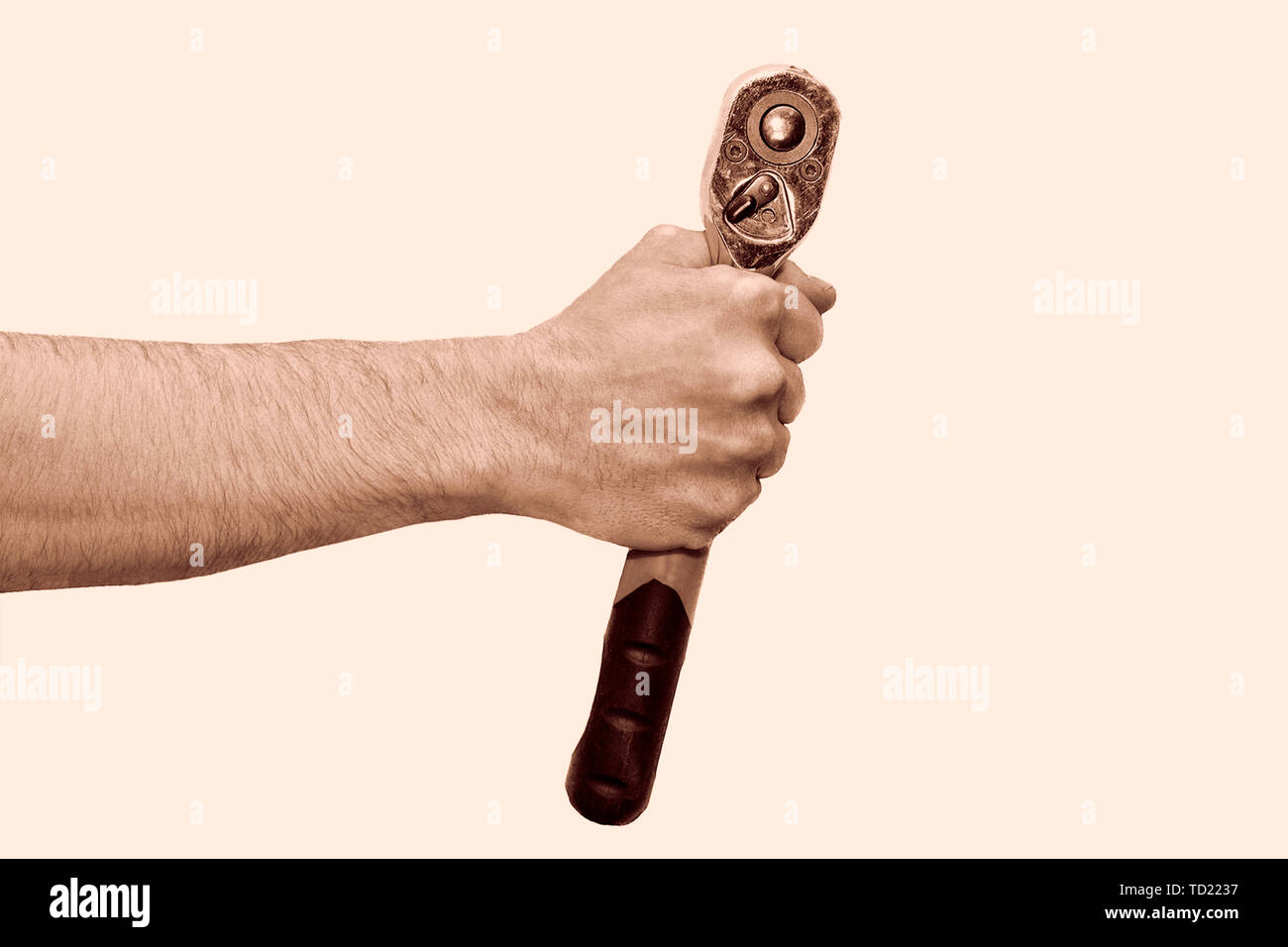 Hand holding a ratchet wrench isolated on white. Mechanic hand hold ...