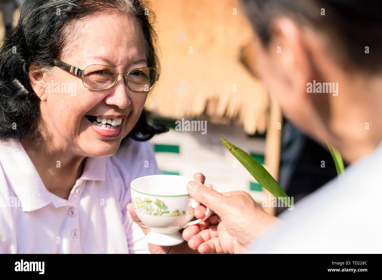 Woman hand offering tea hi-res stock photography and images - Alamy