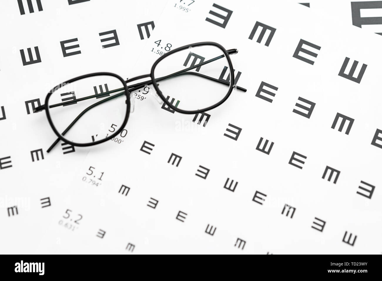 Black glasses and visual meter on white background Stock Photo - Alamy