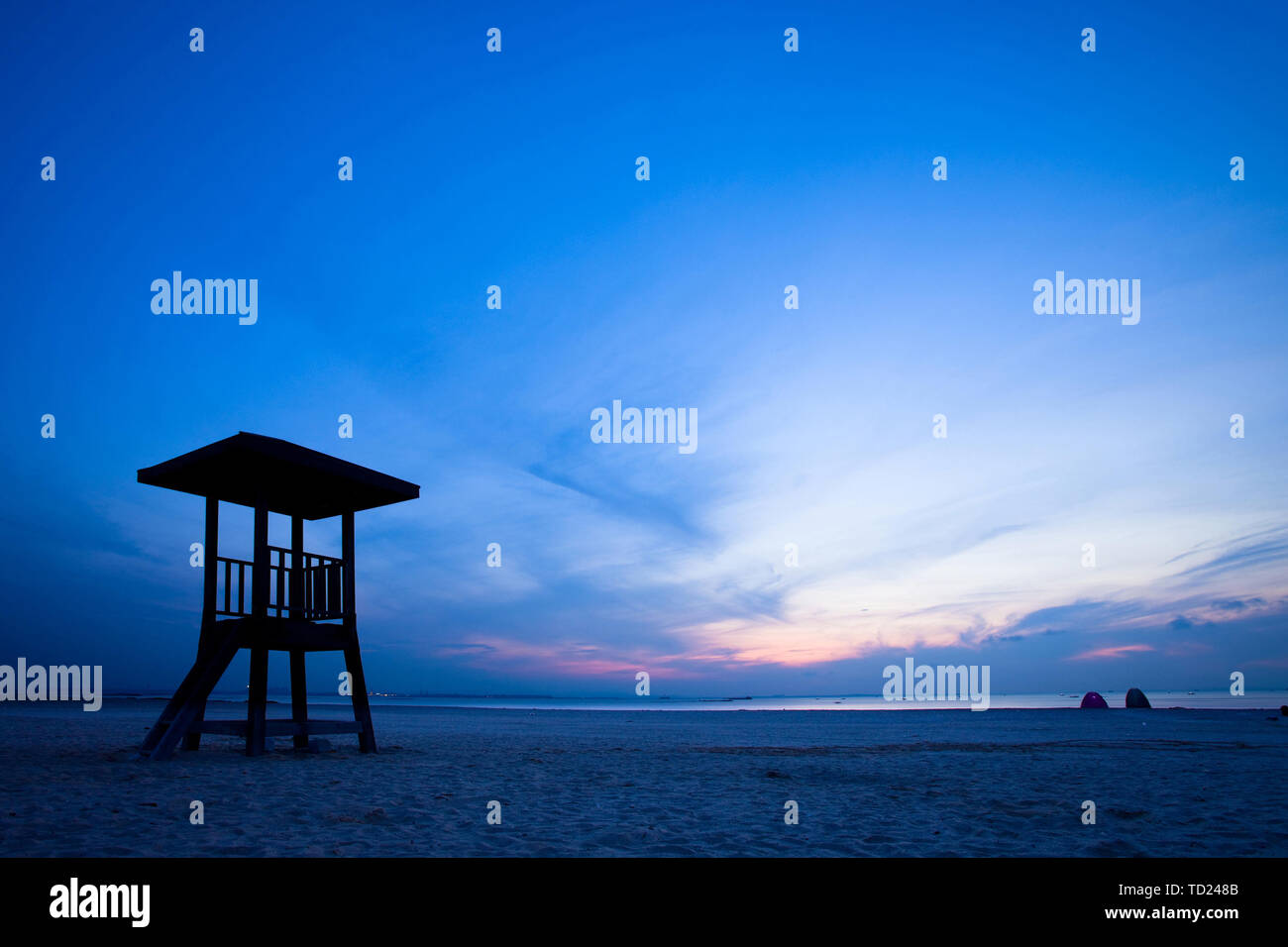Observation tower on the beach with sunrise Stock Photo - Alamy