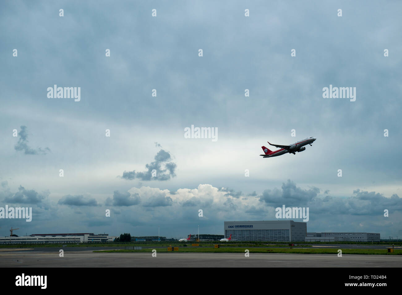 Civil aviation flights of aircraft. Cloudy weather. Dark clouds Stock ...