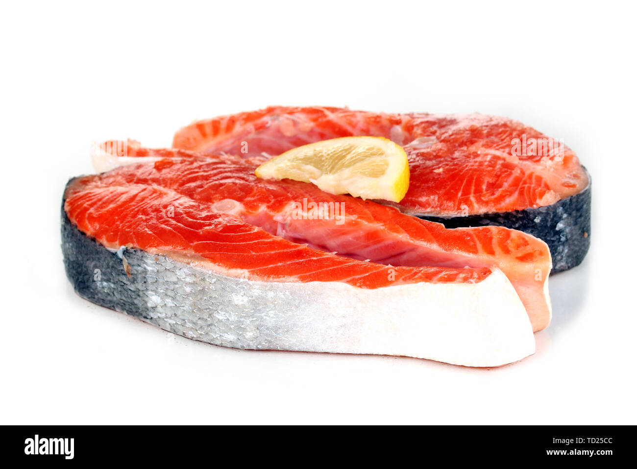 Pieces of red fish isolated on white Stock Photo - Alamy