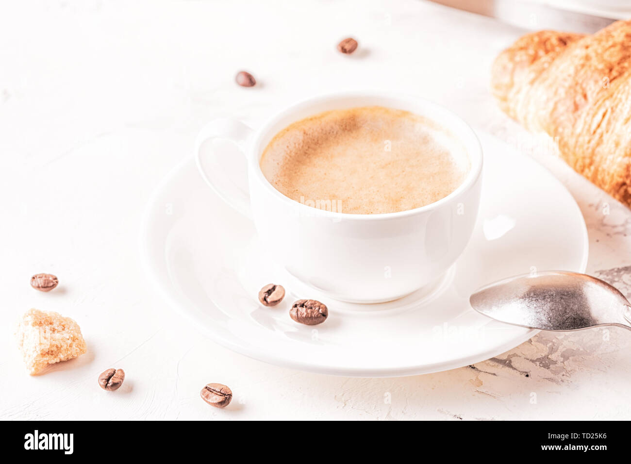 Traditional breakfast with fresh croissants on white background ...