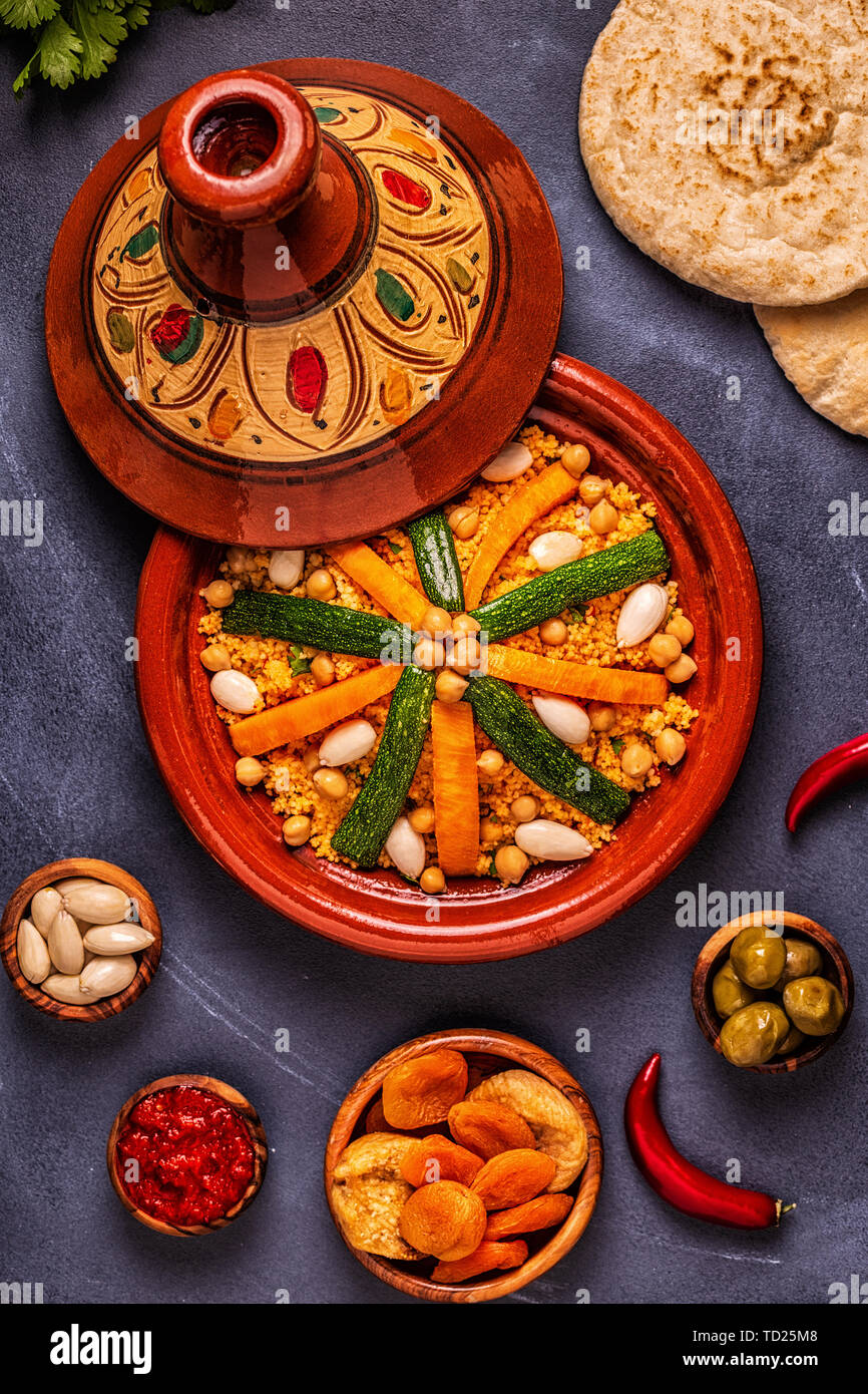 Vegetable tagine with almond and chickpea couscous, top view Stock ...