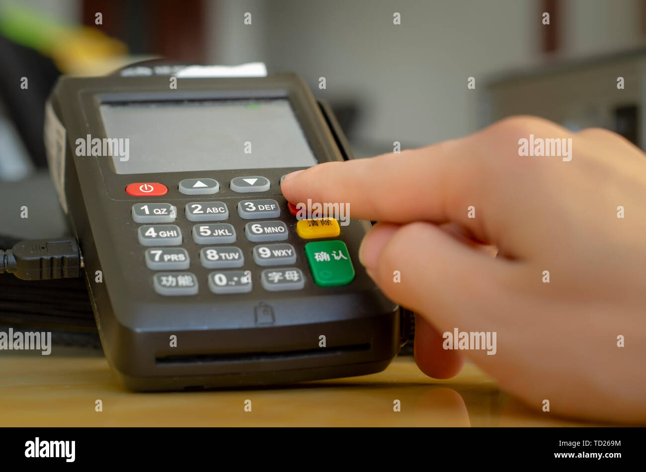 One finger is pressing the POS button Stock Photo - Alamy
