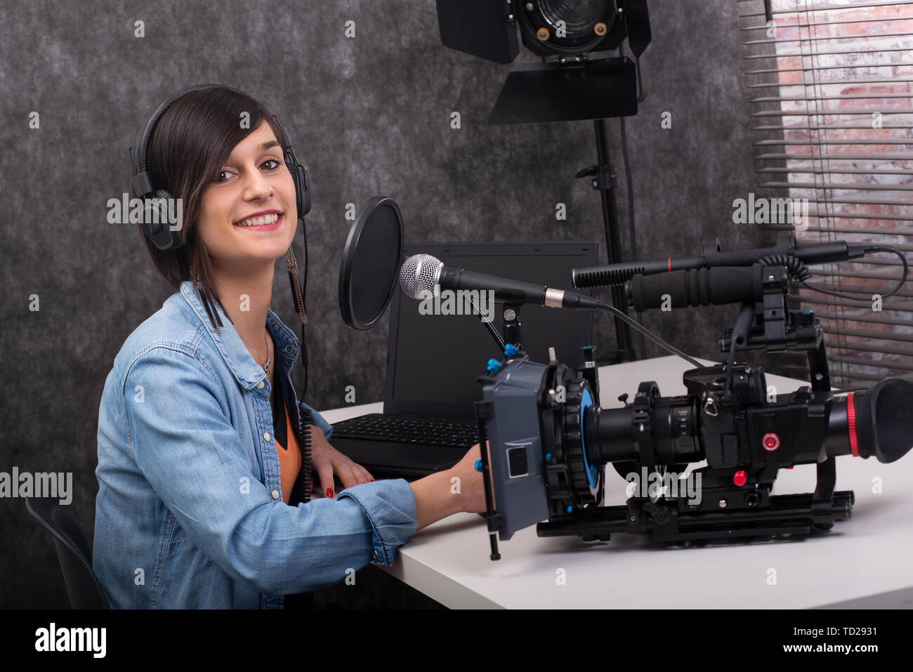 pretty young woman video editor working in studio Stock Photo - Alamy