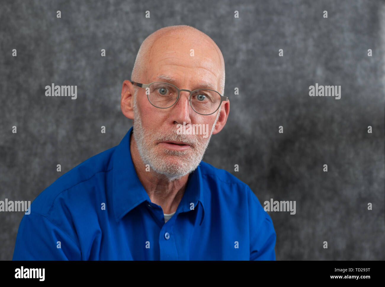 Wicked man, a portrait of a man with the pursed lips looking straight ...