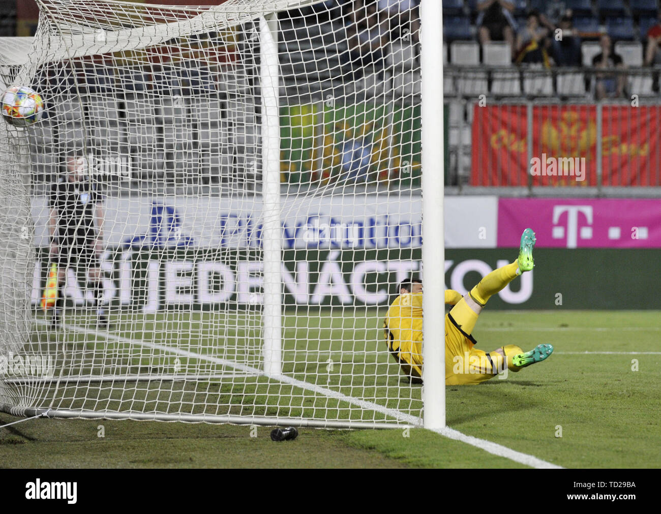 Montenegro goalkeeper Milan Mijatovic is unable to stop a goal by ...