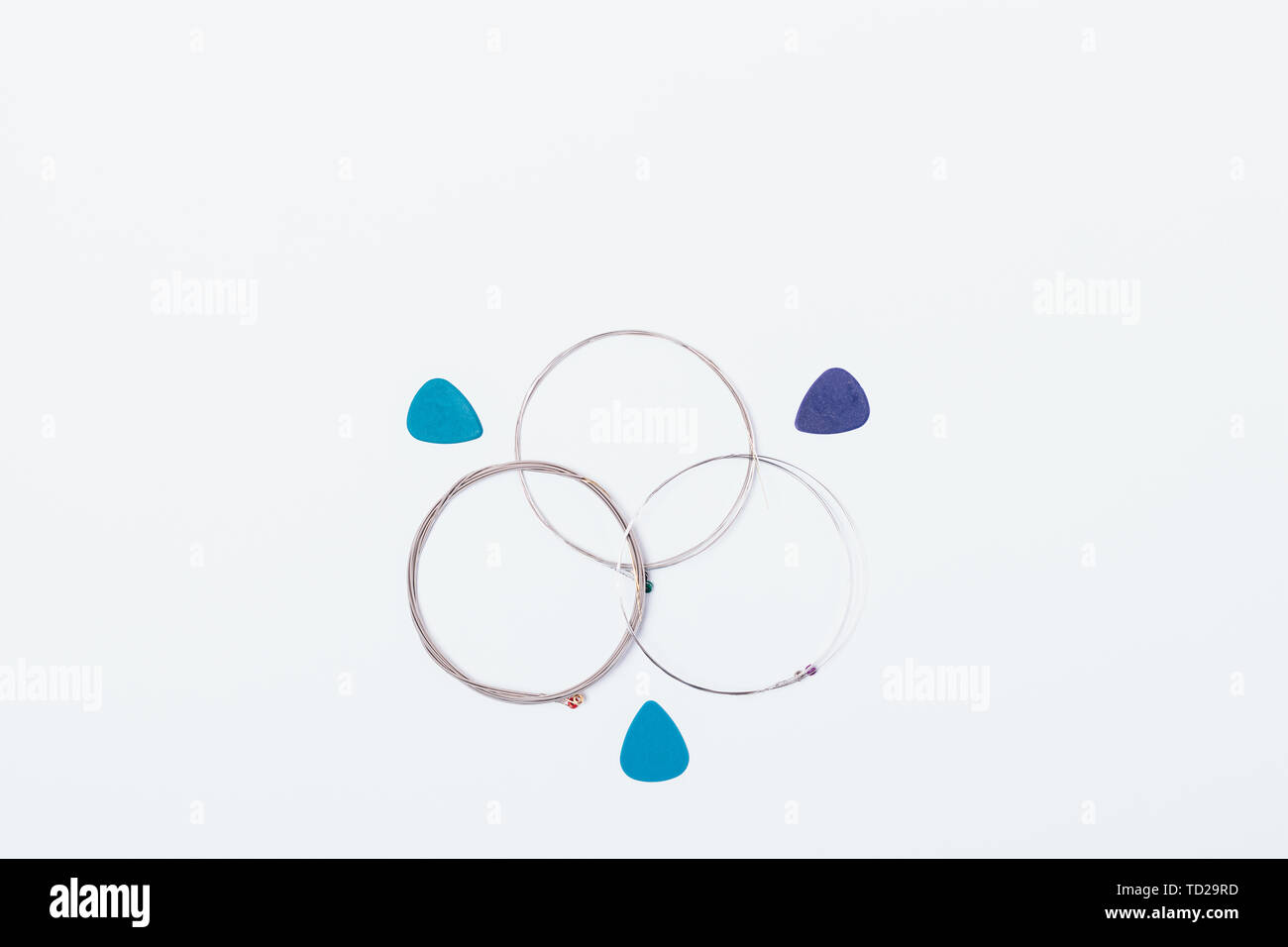 Top view guitar strings and picks on white background, copy space Stock ...