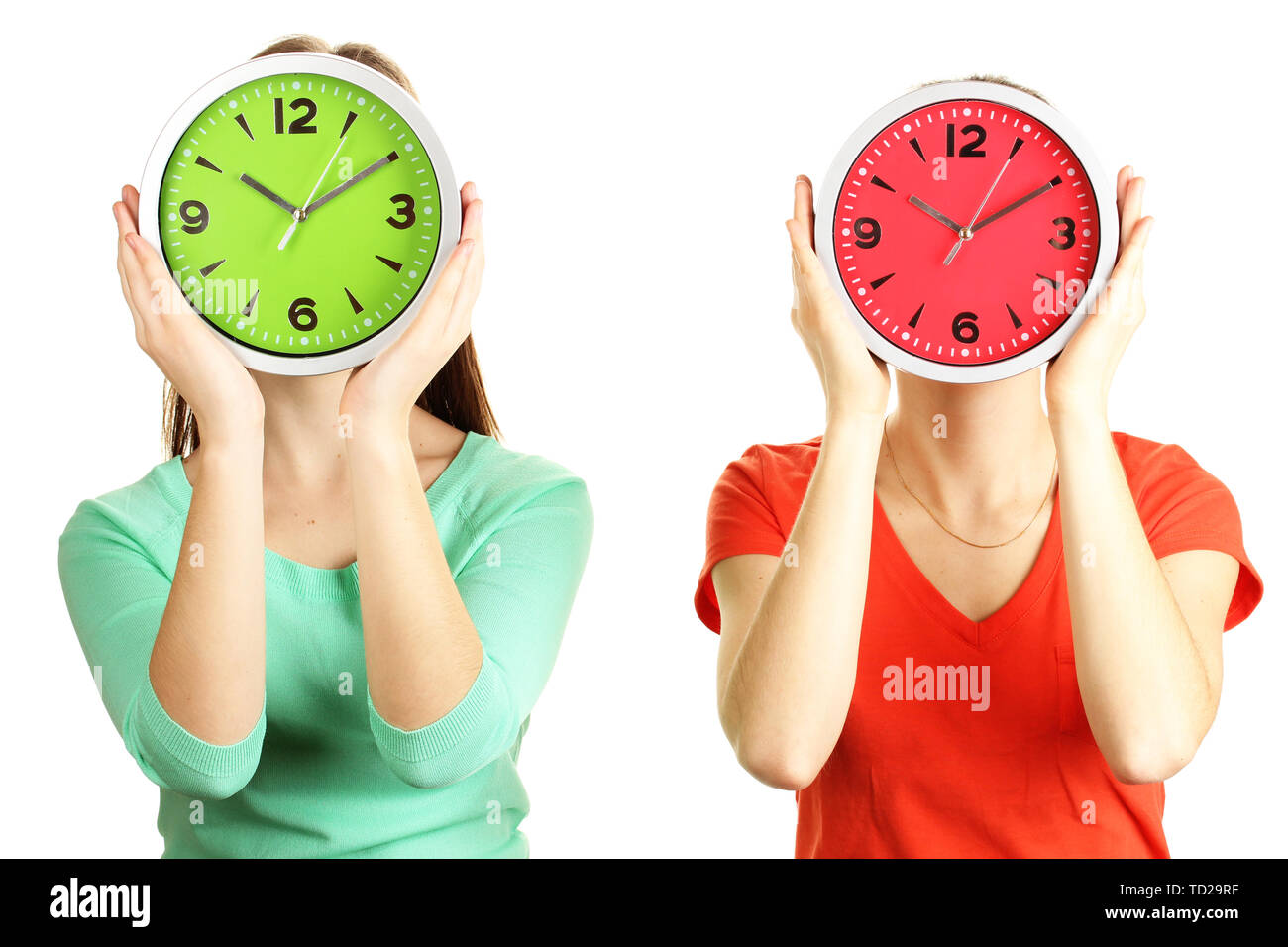 Girls holding clocks over face isolated on white Stock Photo - Alamy