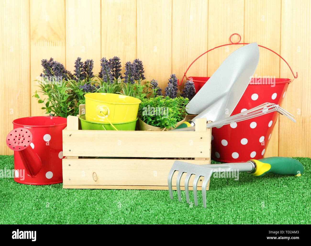 Garden tools on grass in yard Stock Photo - Alamy