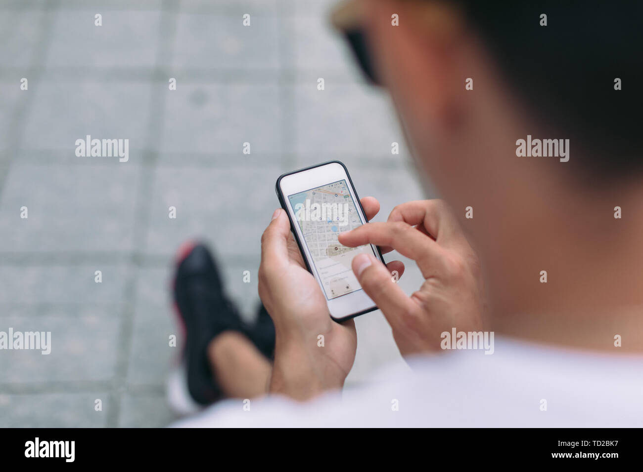 Man looking on navigation map. Travelers using gps map for sightseeing ...