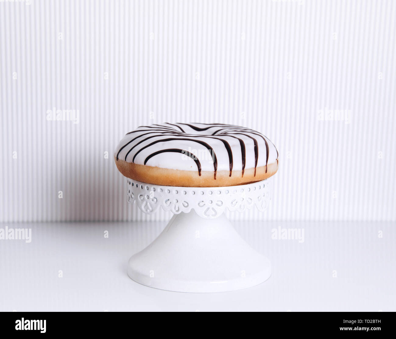 Striped donuts on a white background. Stylish minimal concept Stock ...