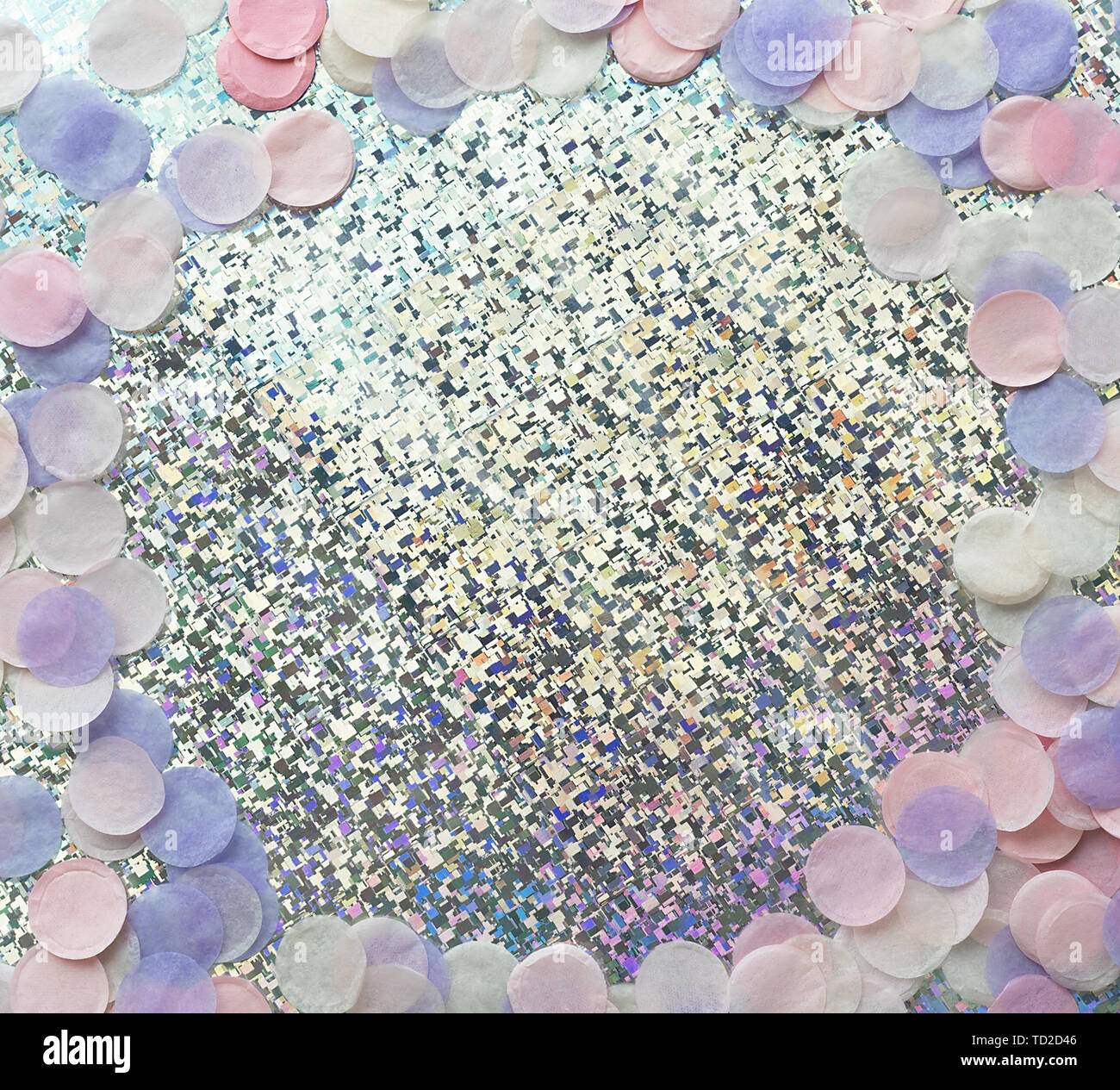 Frame of pastel colored confetti on shiny holographic background ...