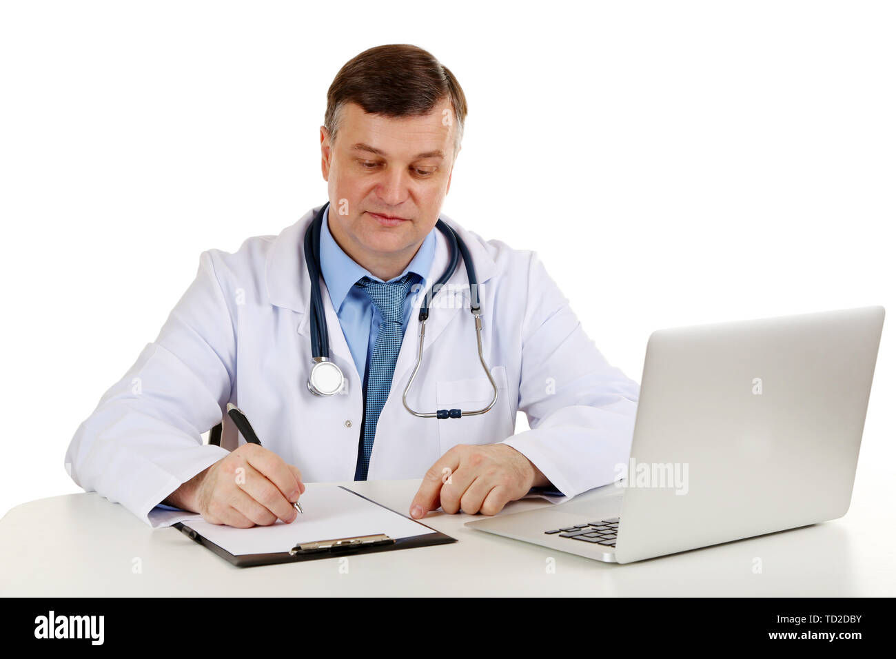 Medical doctor working at desk isolated on white Stock Photo - Alamy