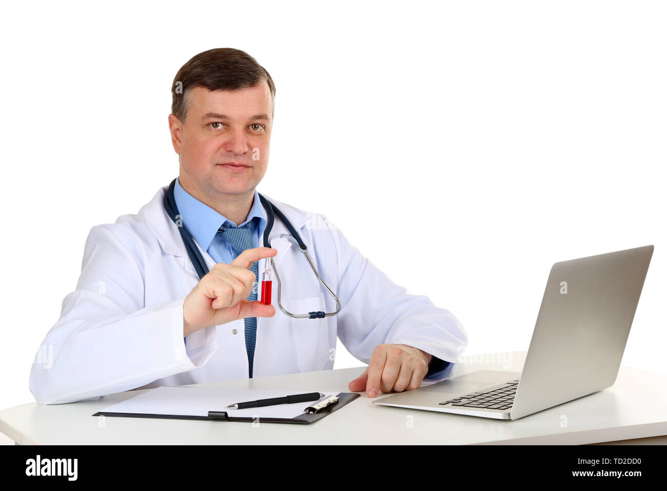 Medical doctor working at desk isolated on white Stock Photo - Alamy