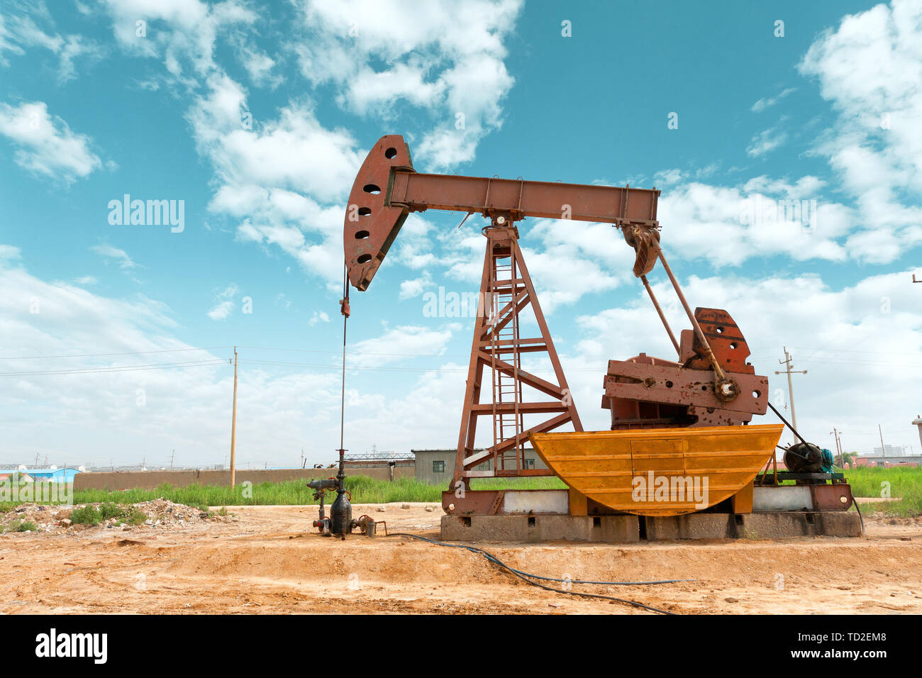 Oil well and bluesky Stock Photo - Alamy