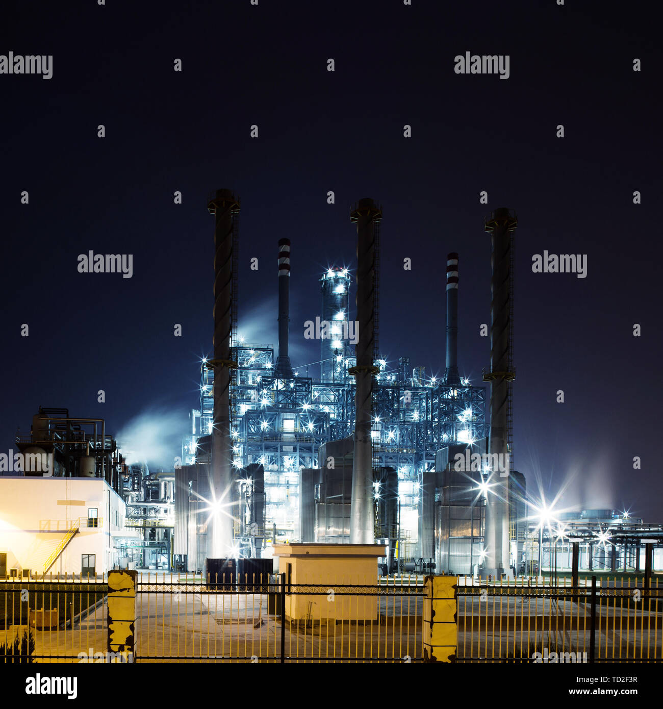 Modern oil refinery factory at night Stock Photo - Alamy
