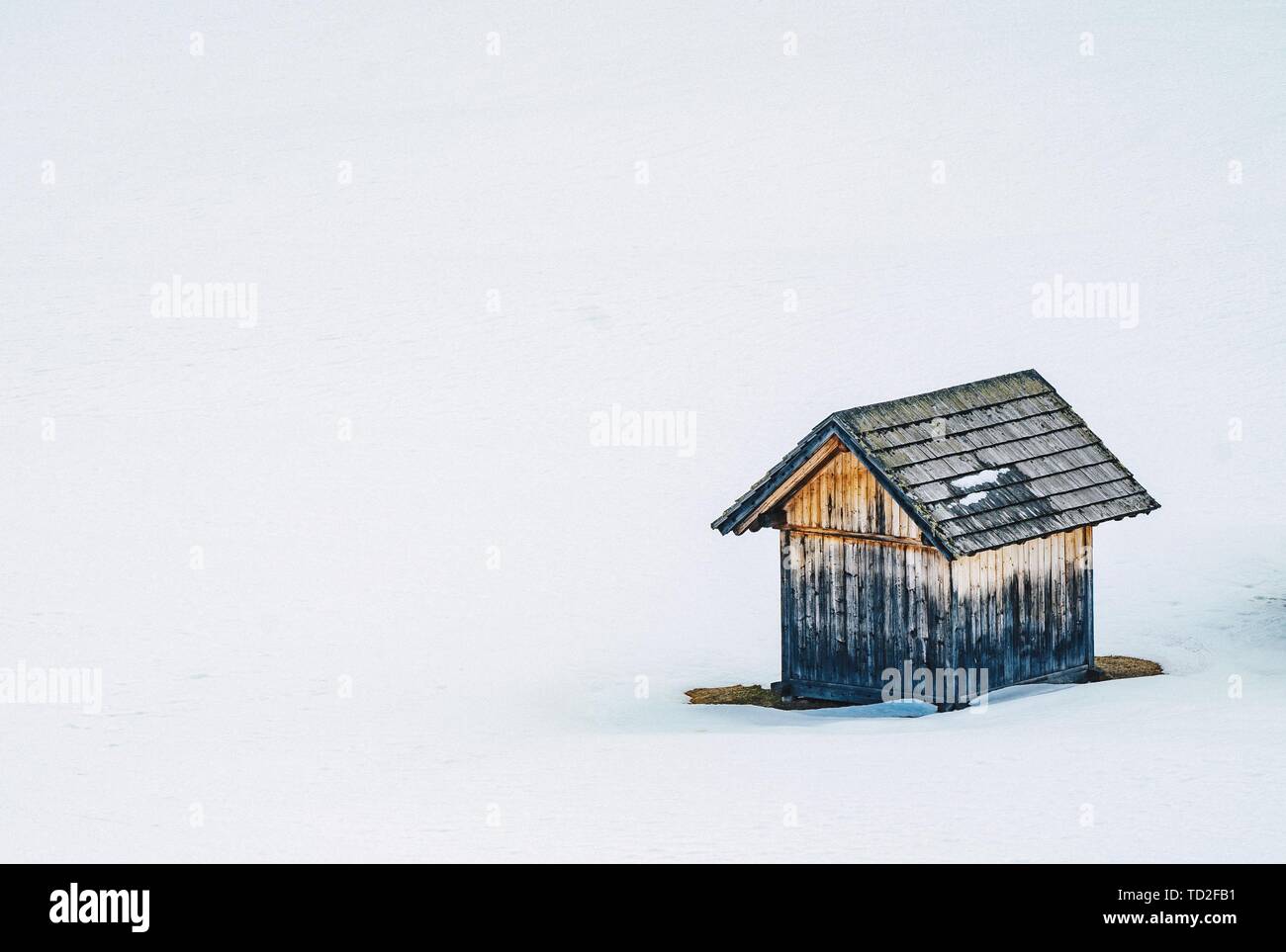 Small wooden barn in a snowy field Stock Photo - Alamy