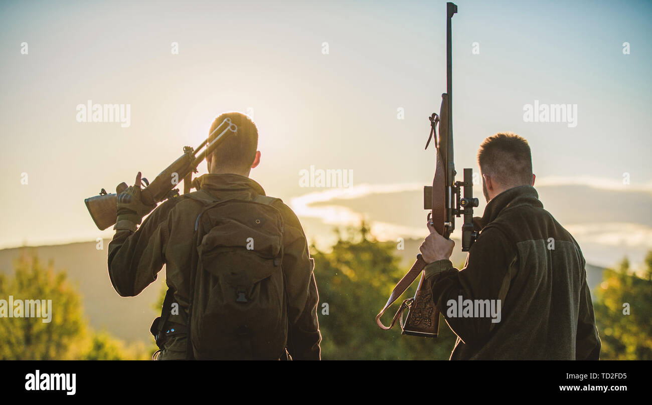 Hunters friends enjoy leisure. Hunters friends gamekeepers with guns ...