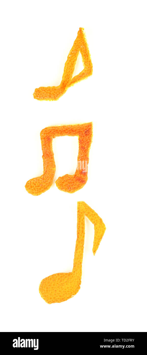 Decorative musical notes from dry orange peel isolated on white Stock ...