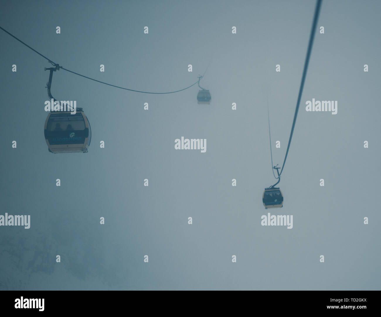 Cloud fog cable car Stock Photo - Alamy