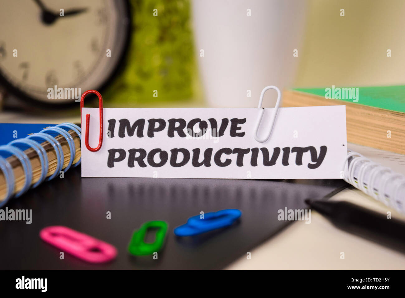 Improve Productivity on the paper isolated on it desk. Business and ...