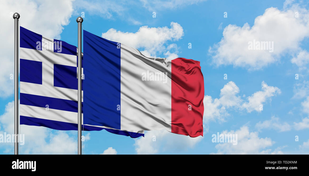 Greece and France flag waving in the wind against white cloudy blue sky ...