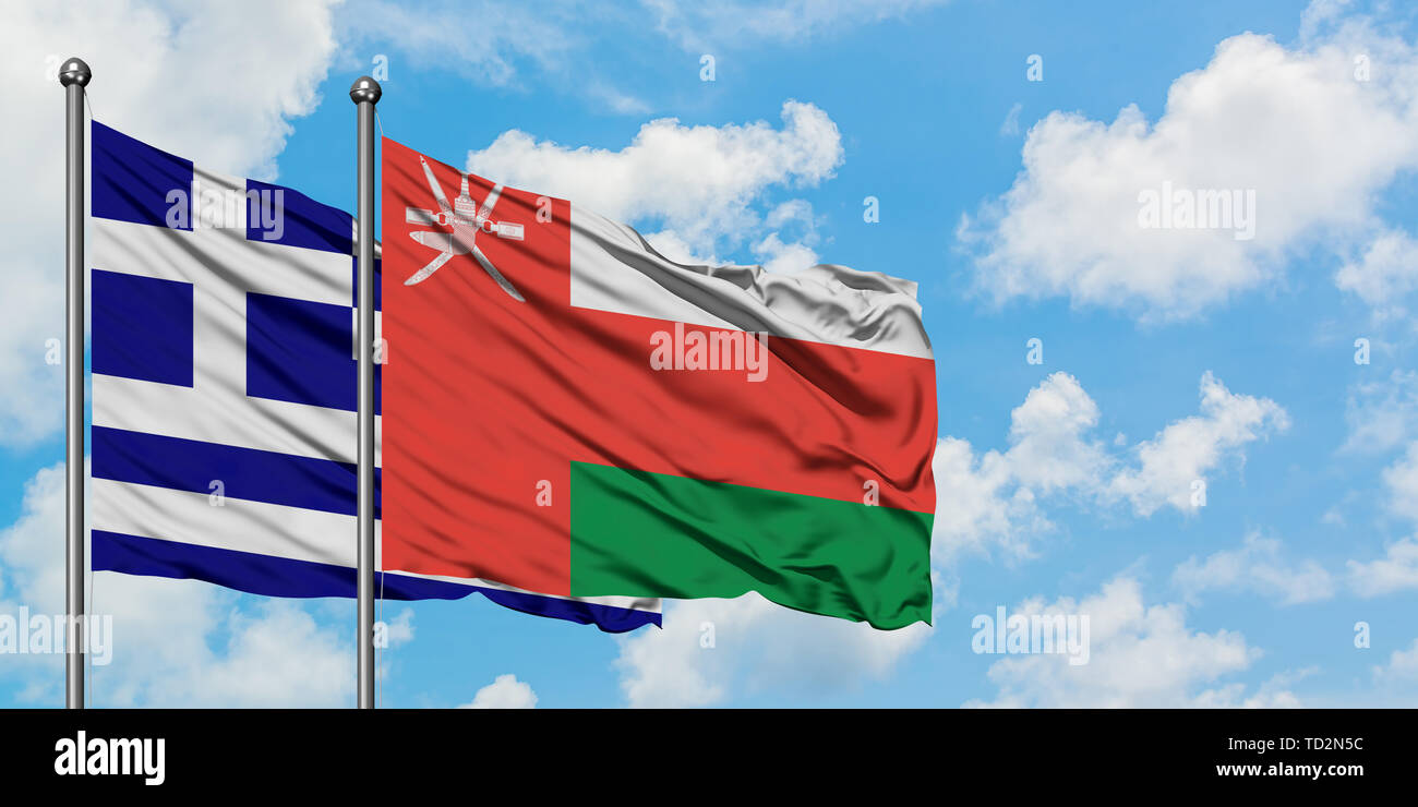Greece and Oman flag waving in the wind against white cloudy blue sky ...