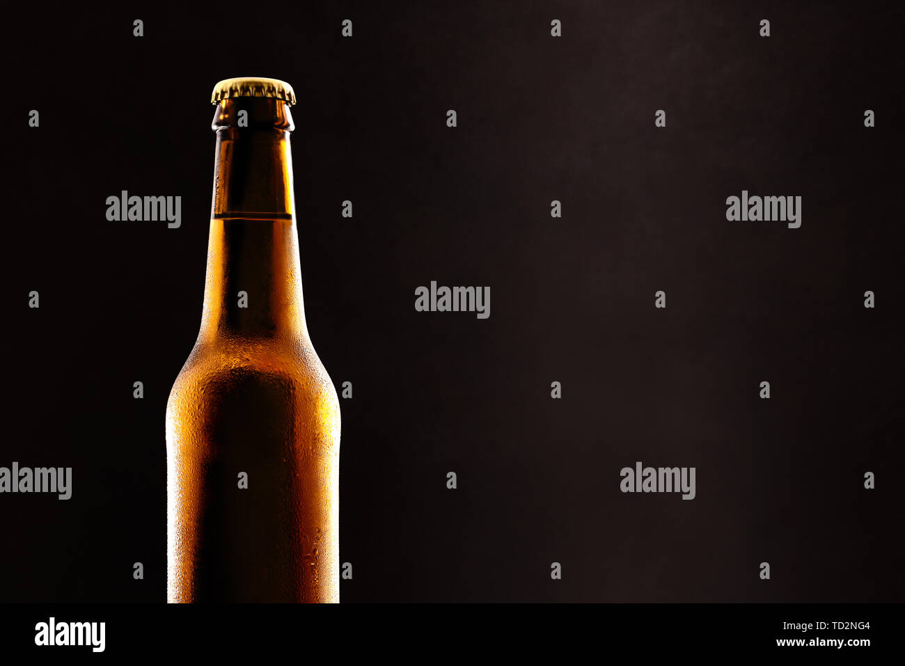 Beer bottle filled and closed close up and black background. Horizontal ...