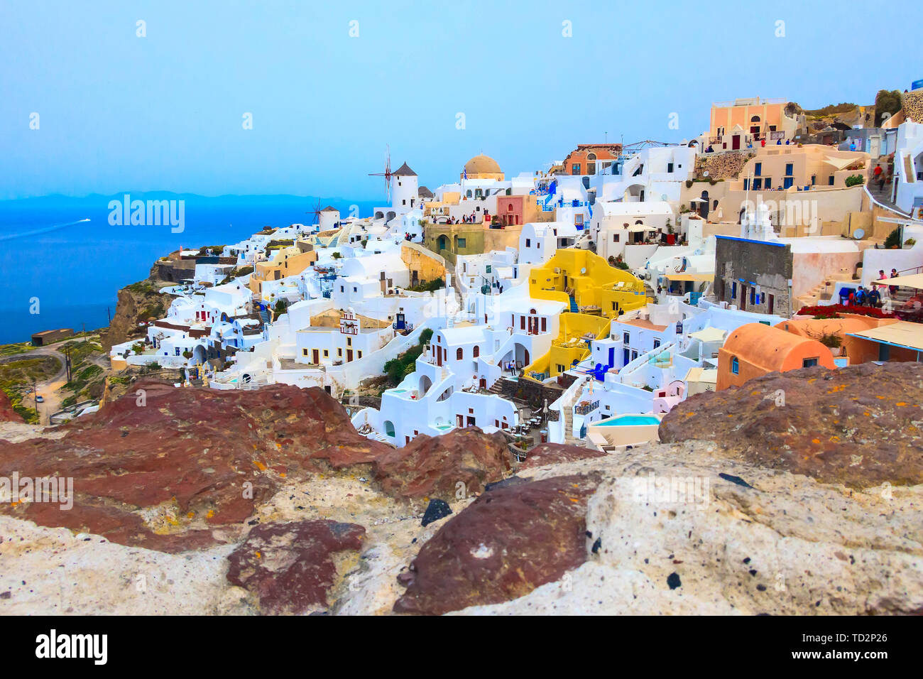 Santorini island, Greece, Oia village with windmills and colorful ...