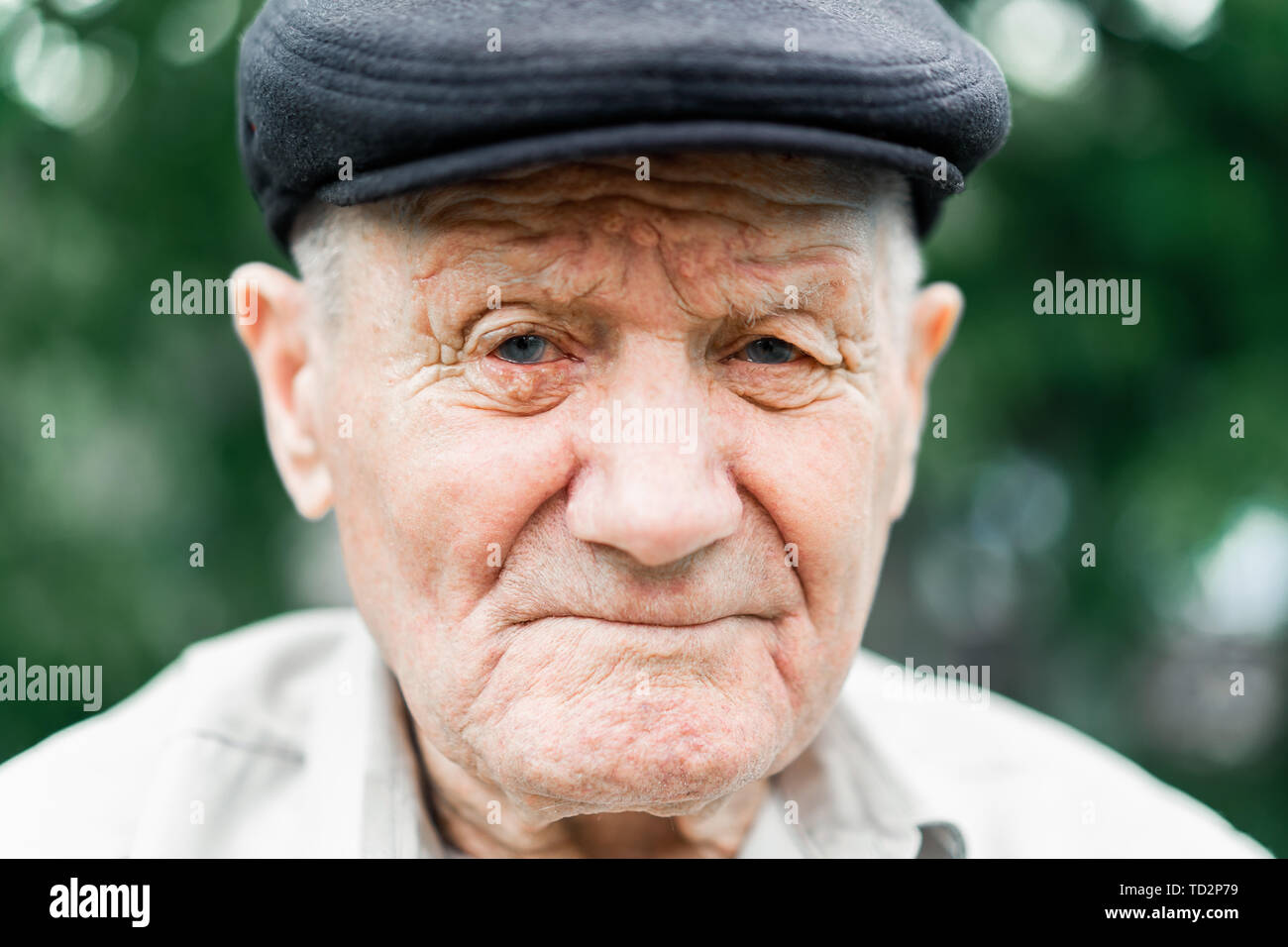 Very old caucasian man portrait. Grandfather in hat. Portrait: aged ...