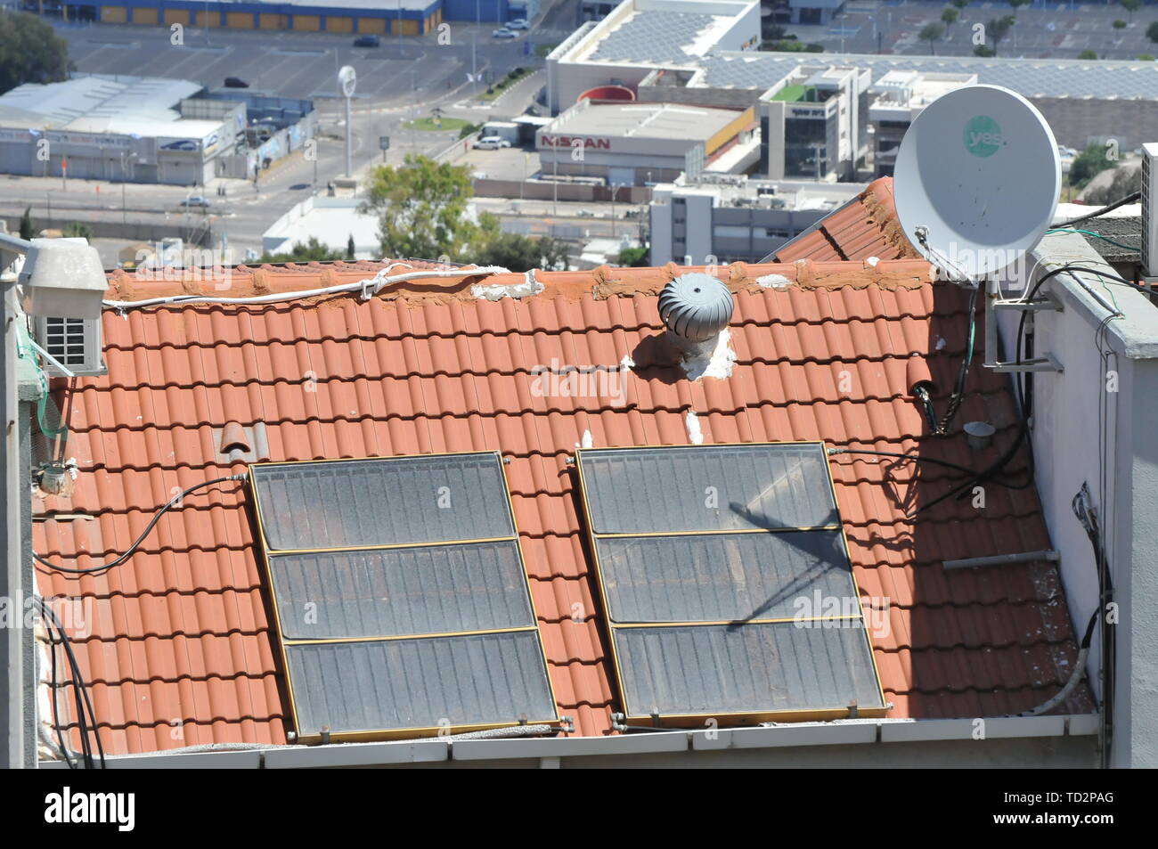 Solar water heater collectors on a roof. Photographed in Haifa, Israel ...