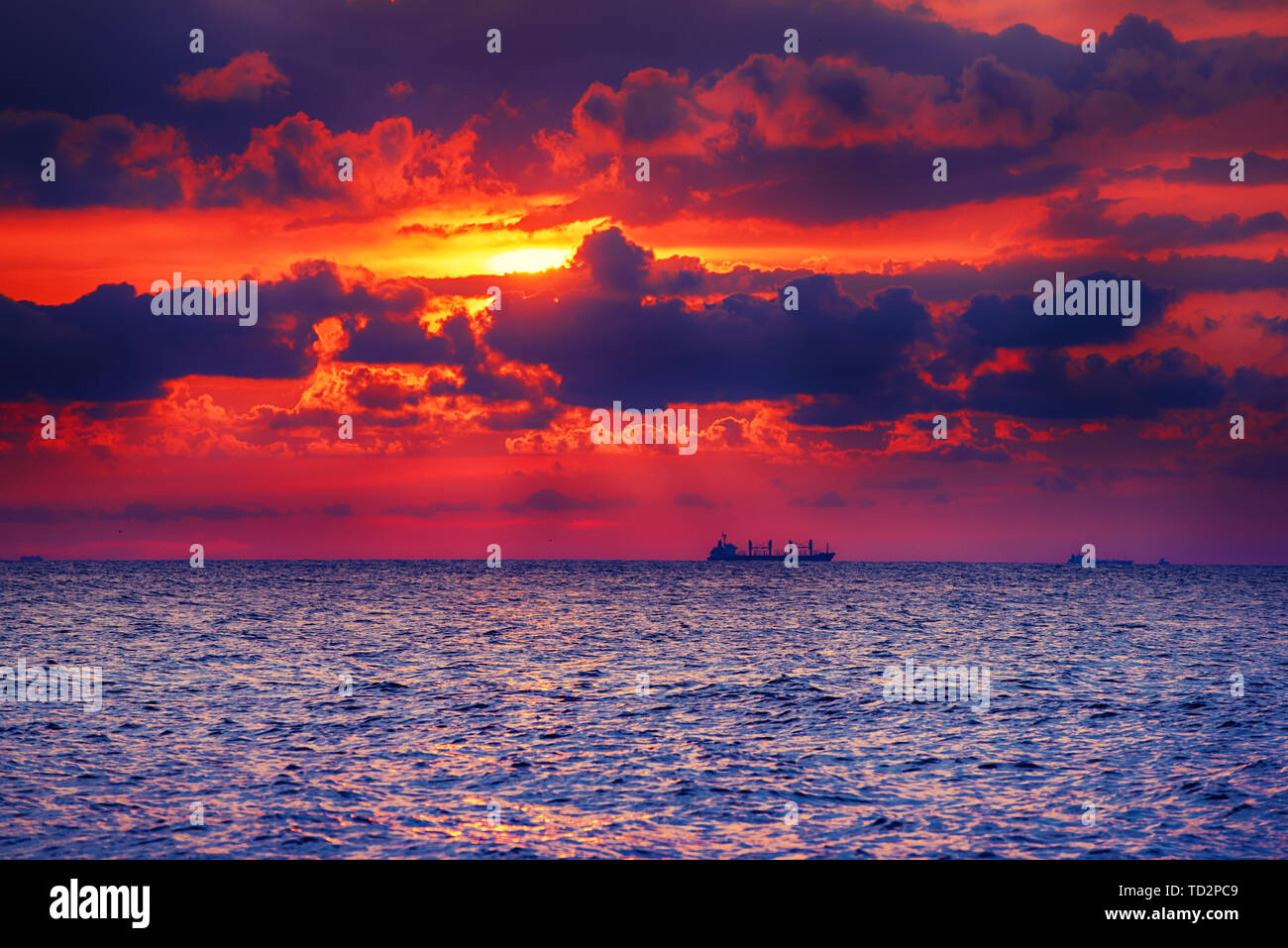 Sunrise with a boat Stock Photo - Alamy
