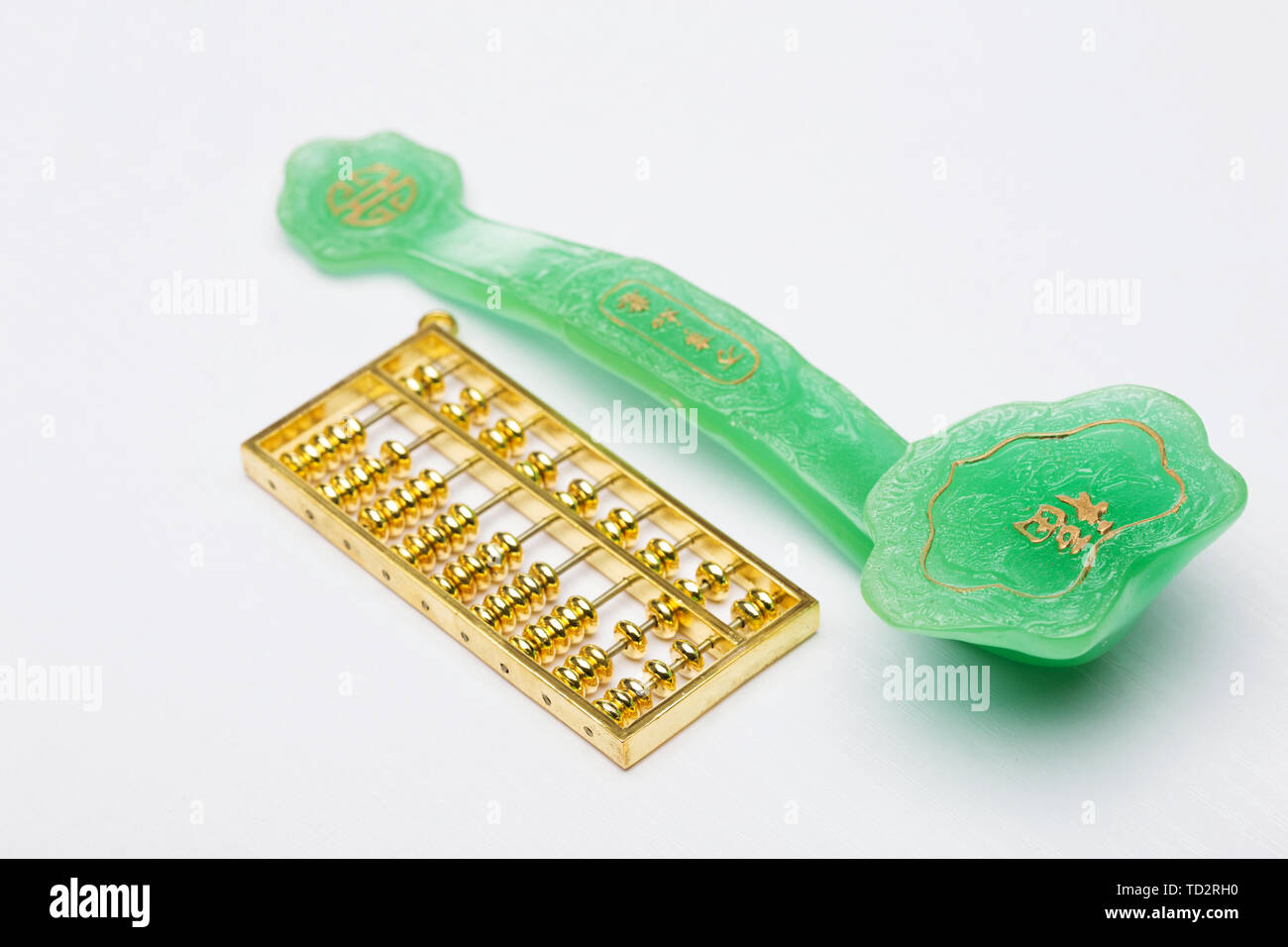 Abacus and jade ruyi with background Stock Photo - Alamy