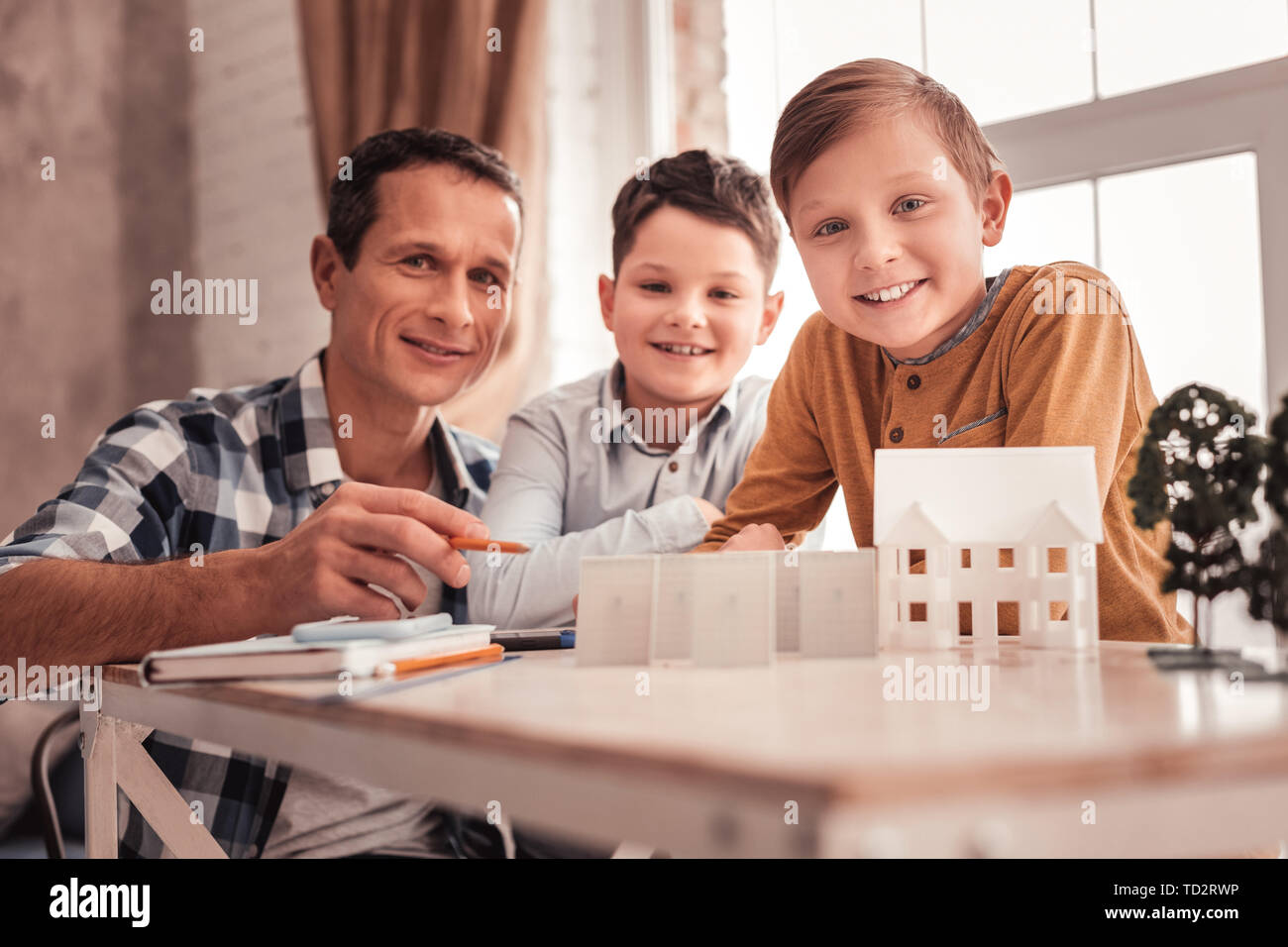 Smart tutor showing his curious pupils model of smart city Stock Photo ...