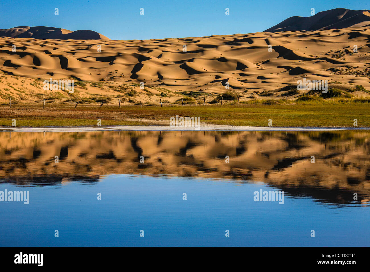 Desert sand mountain lake water reflection Stock Photo - Alamy