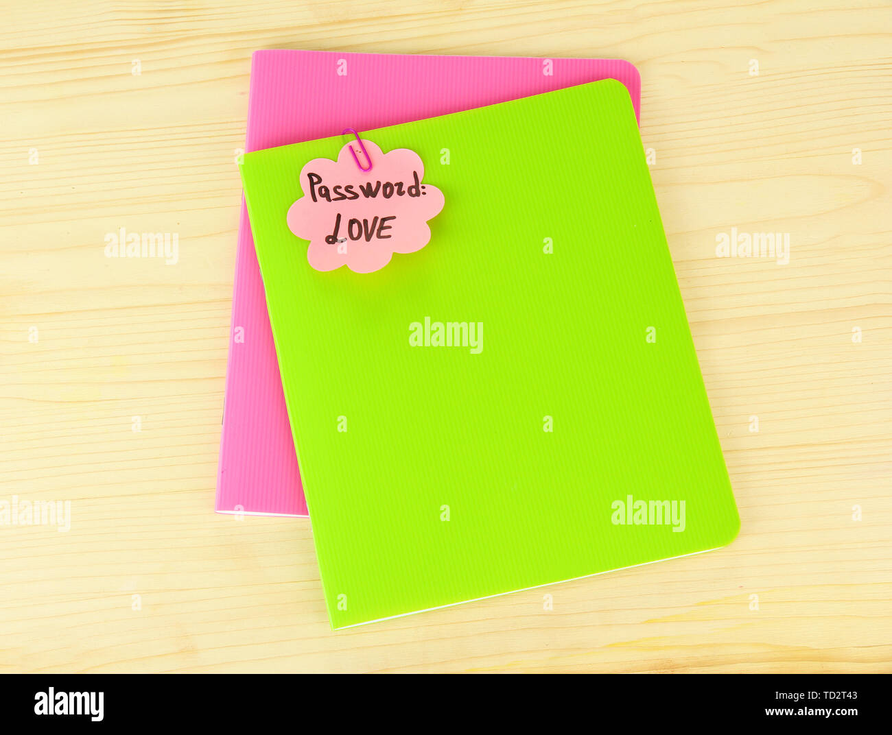 Sticker-reminder with most popular password, on notebook, on wooden ...