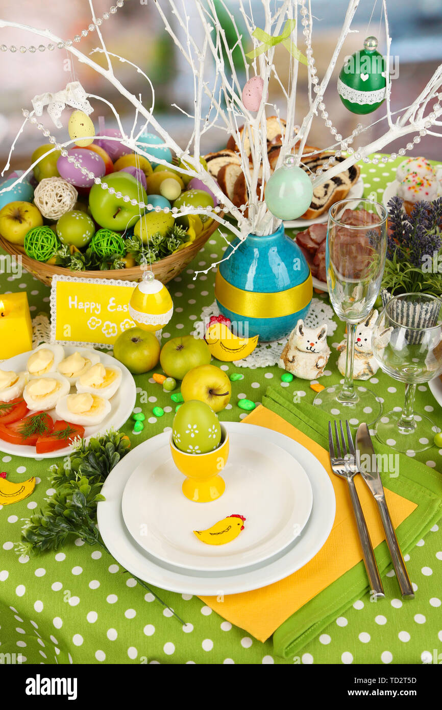 Serving Easter table with tasty dishes on room background Stock Photo ...