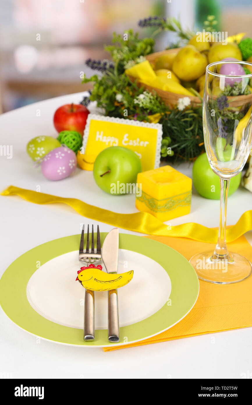 Serving Easter table on room background Stock Photo - Alamy