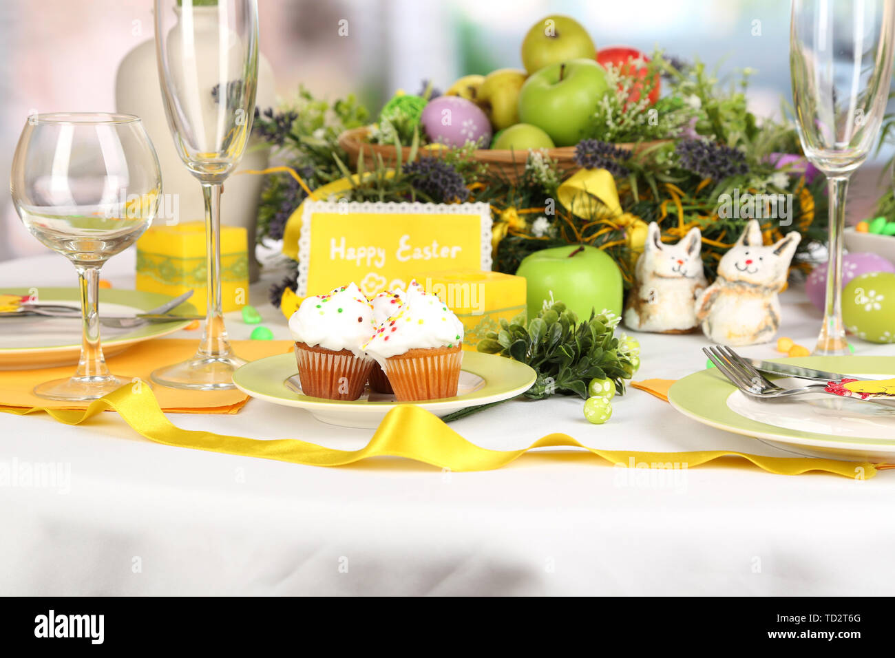 Serving Easter table on room background Stock Photo - Alamy