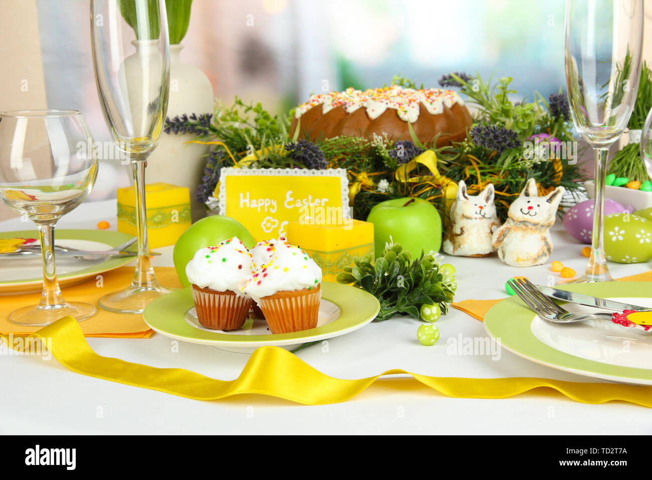 Serving Easter table on room background Stock Photo - Alamy