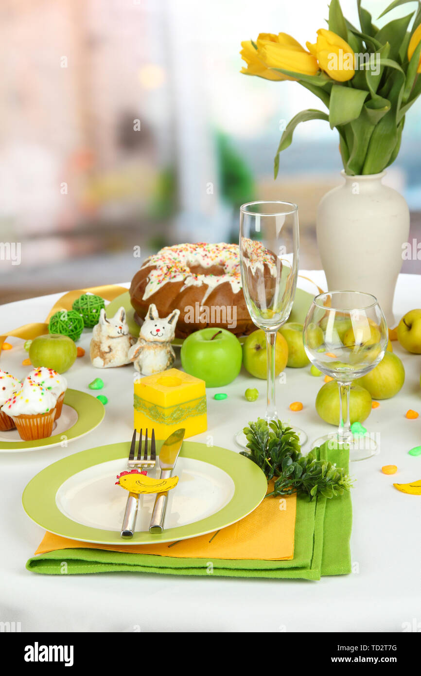 Serving Easter table on room background Stock Photo - Alamy