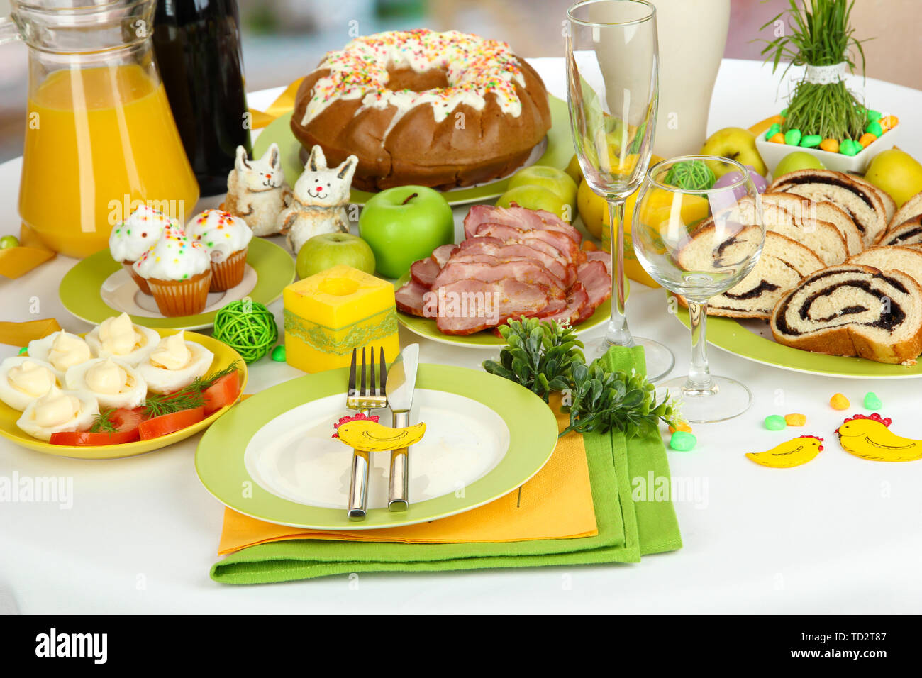 Serving Easter table with tasty dishes on room background Stock Photo ...