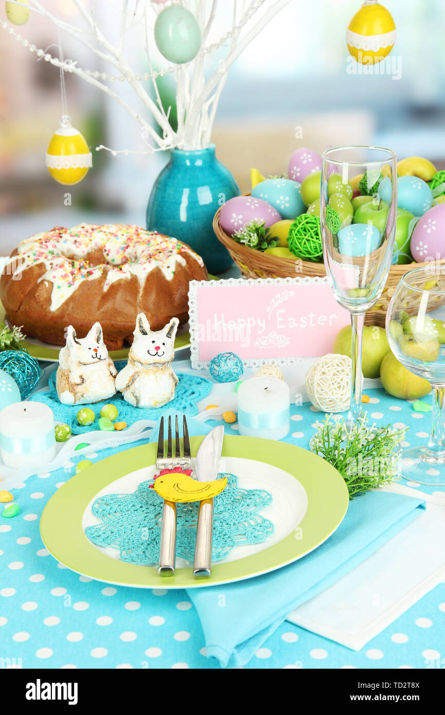 Serving Easter table on room background Stock Photo - Alamy