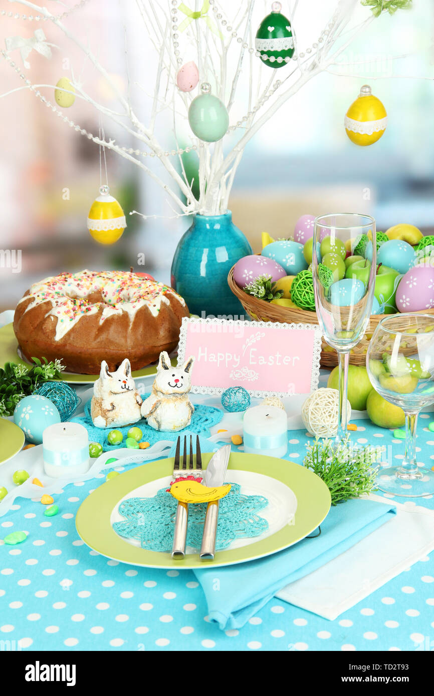Serving Easter table on room background Stock Photo - Alamy
